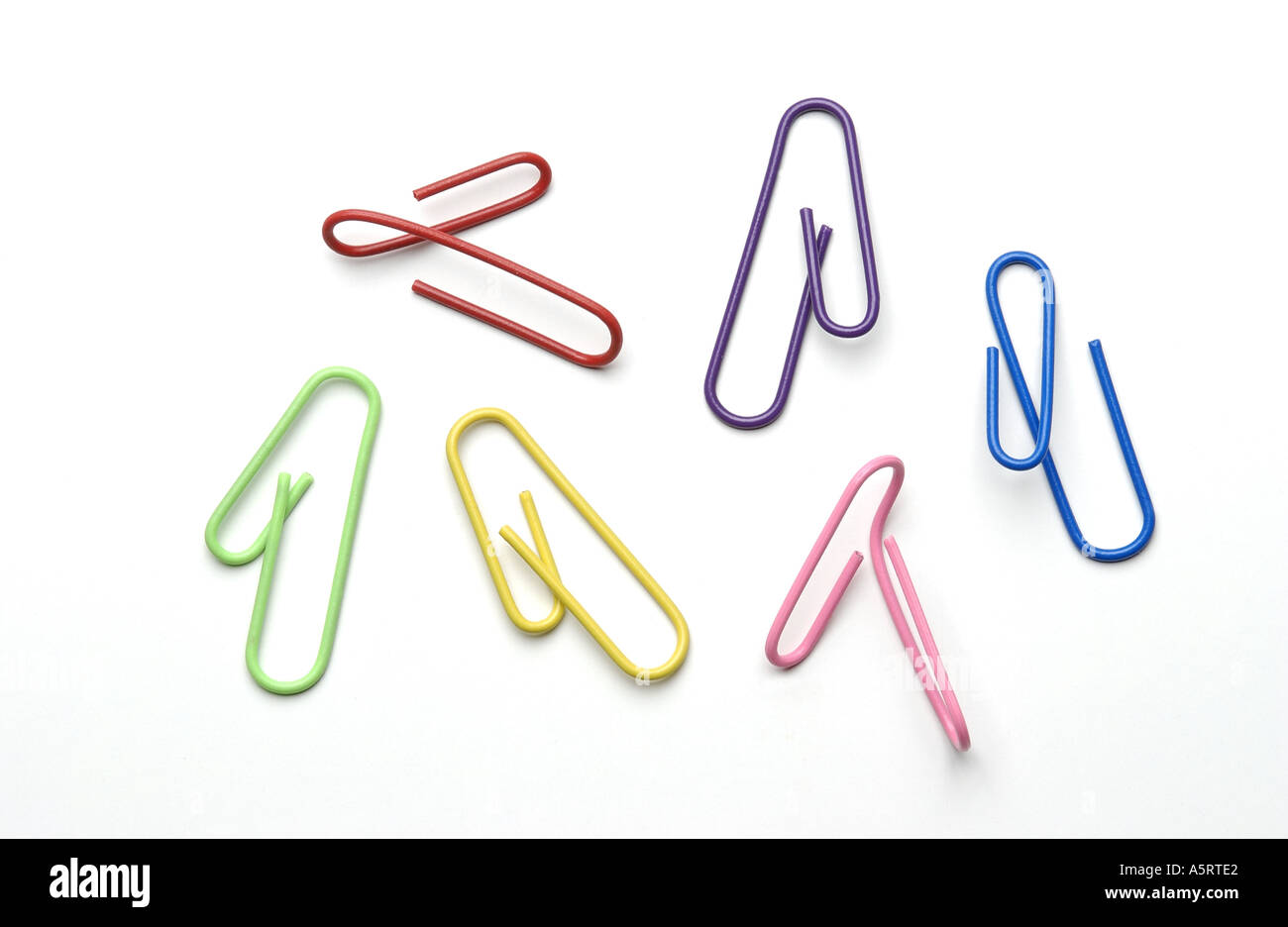 Coloured bent paper clips Stock Photo - Alamy