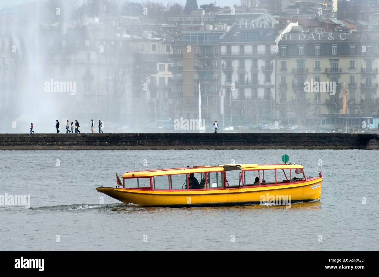 Ferry boat on Lac Geneva View across the lake to the splashes of the ...