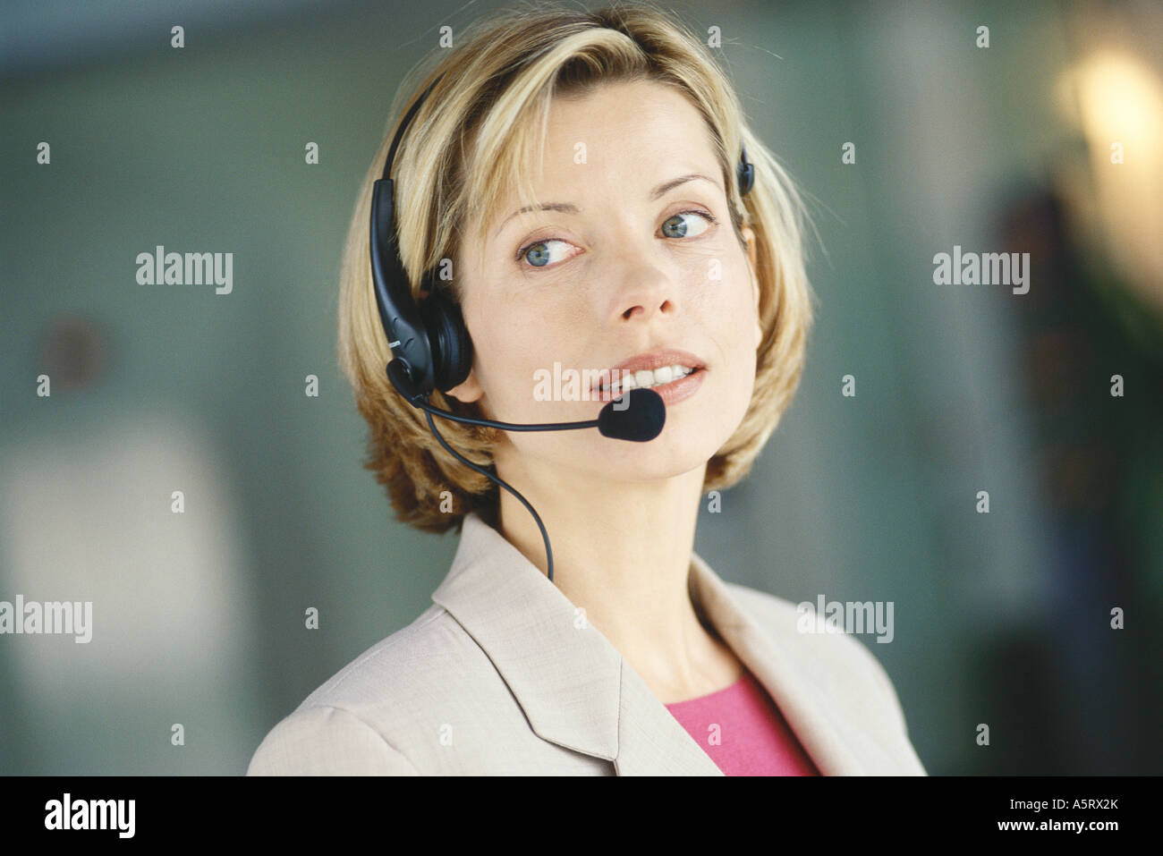 Woman wearing headset Stock Photo - Alamy