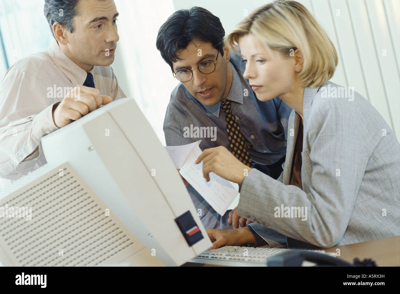 Businessman sitting near desktop hi-res stock photography and images ...