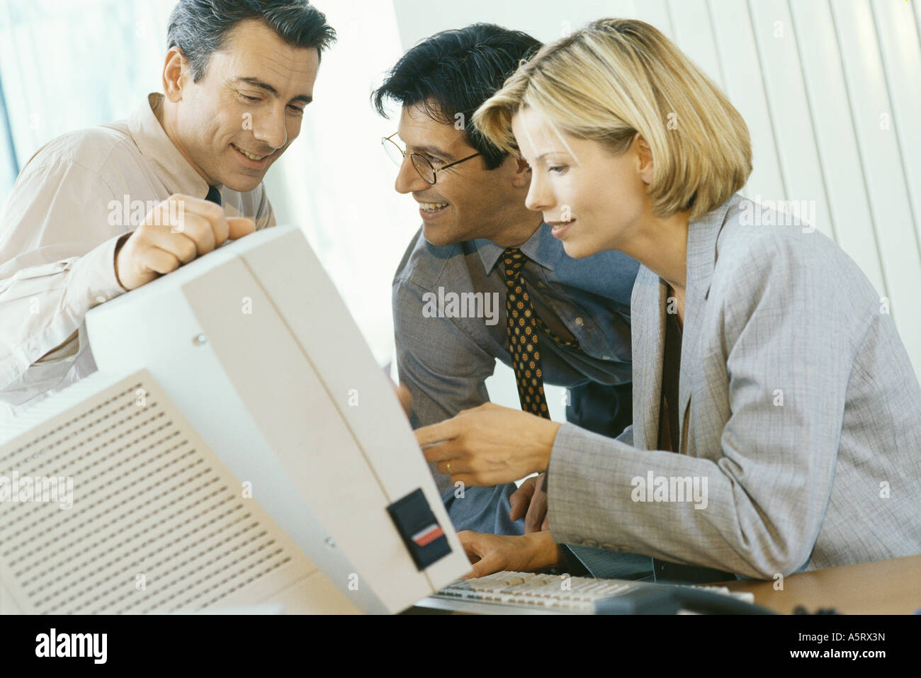 Business associates working desktop computer hi-res stock photography ...