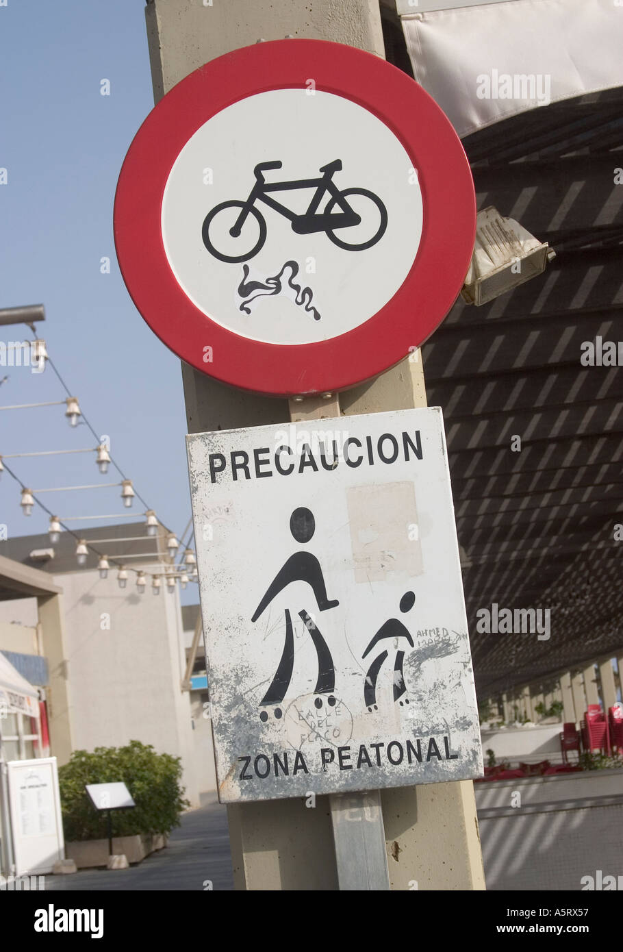 Urban signs saying No Bikes Precaution Pedestrian Zone Stock Photo - Alamy
