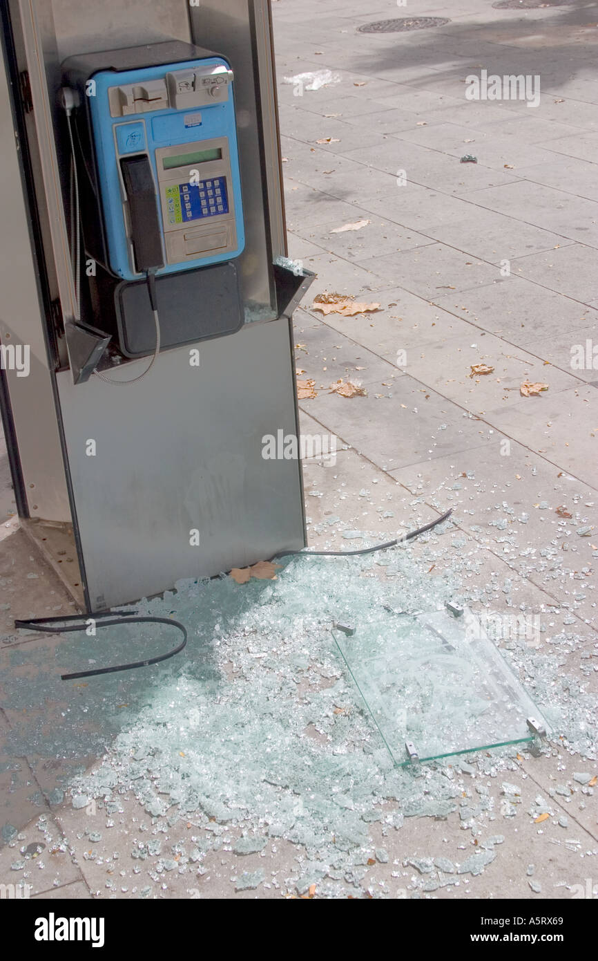 Vandalized telephone box in Spain Stock Photo - Alamy