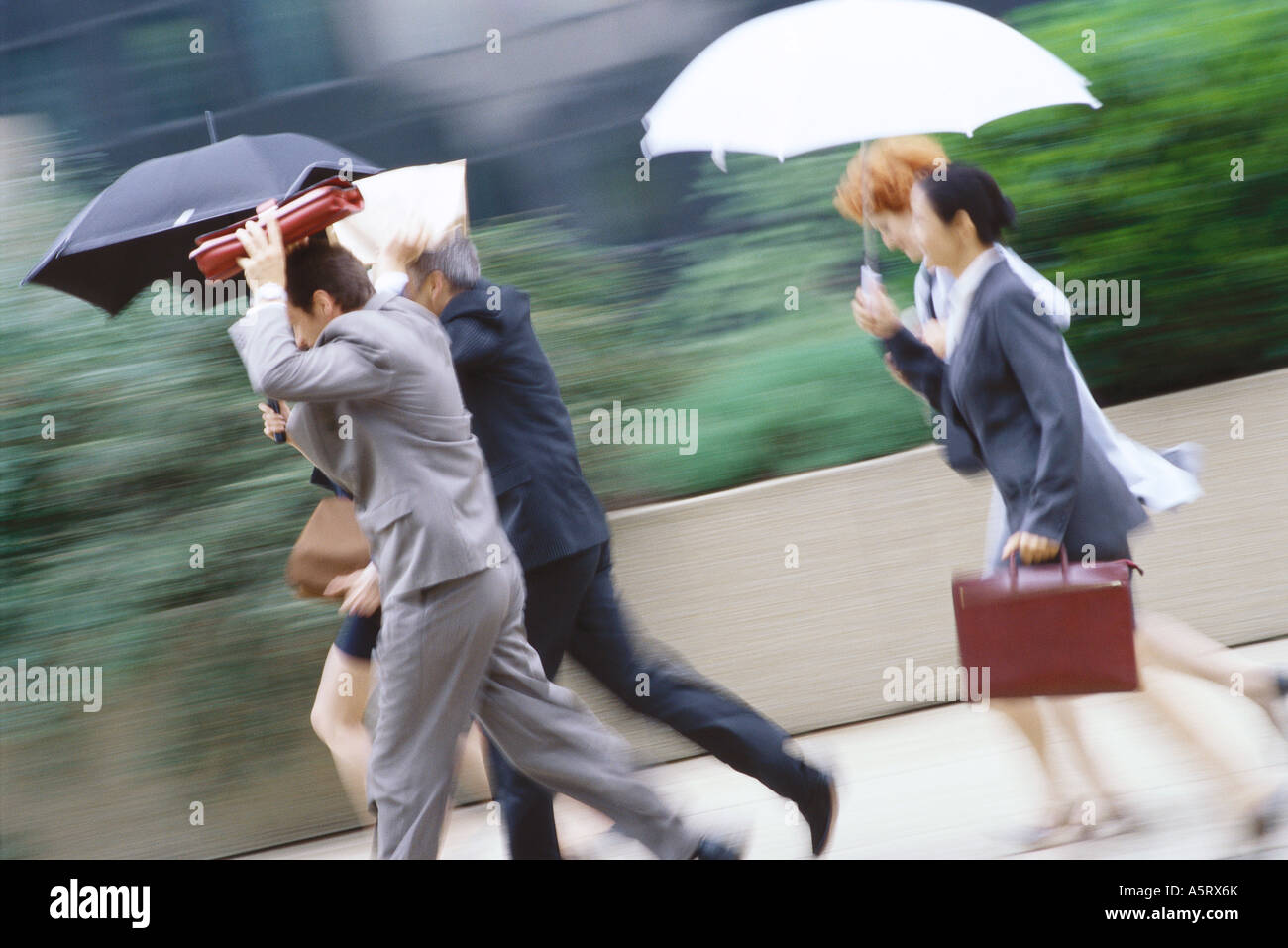 Businessman running rain hi-res stock photography and images - Alamy
