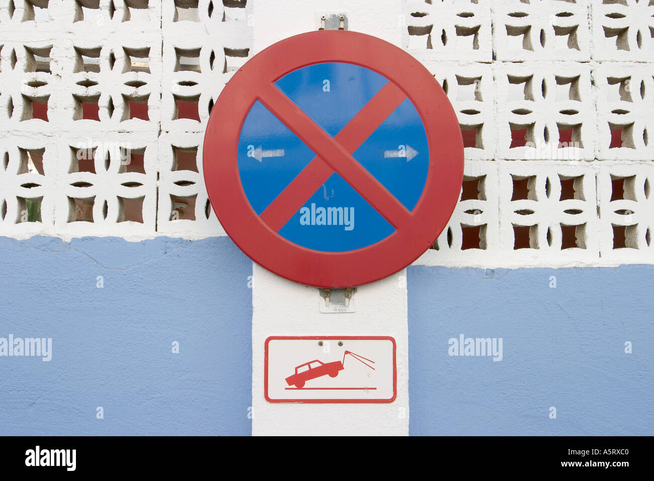 Urban sign No Parking in either direction or car will be towed Stock ...