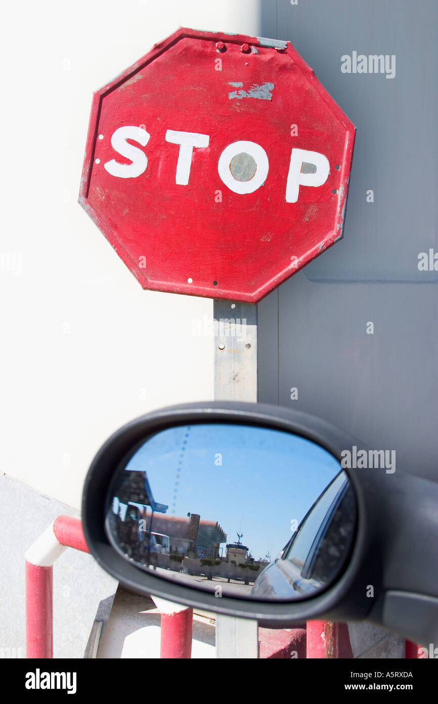 Stop sign and rear vision mirror Stock Photo - Alamy