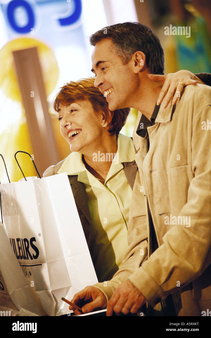 Mature woman boutique shop bags hi-res stock photography and images - Alamy