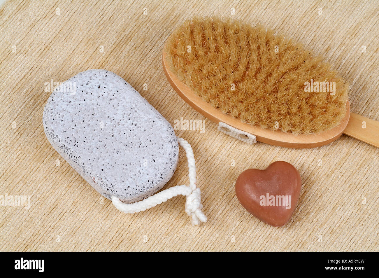 Bath brush, pumice stone and soap on cloth from high angle Stock Photo ...
