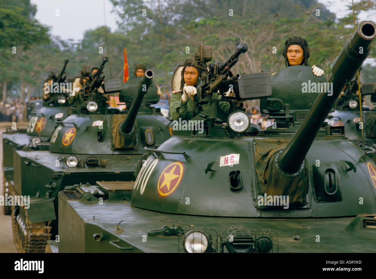 SOLDIERS ON TANKS ALONG A BOULEVARD AT A PARADE TO COMMEMORATE THE 10TH ...