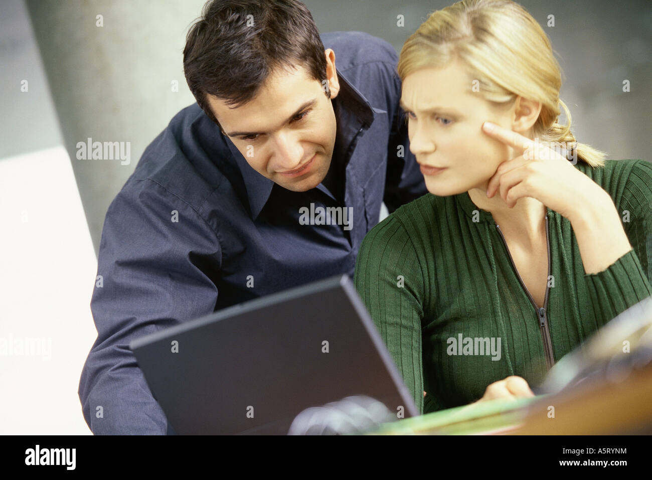 Woman leans over laptop hi-res stock photography and images - Alamy