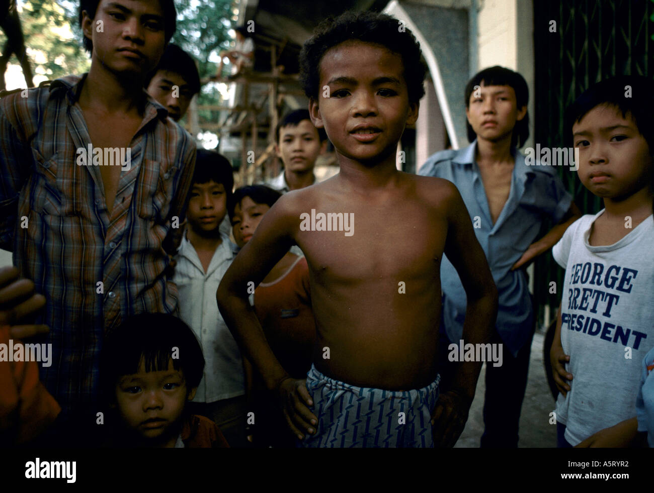 VIETNAM, A MIX RACE YOUNG BOY ON THE STREET WITH OTHER BOYS Stock Photo ...