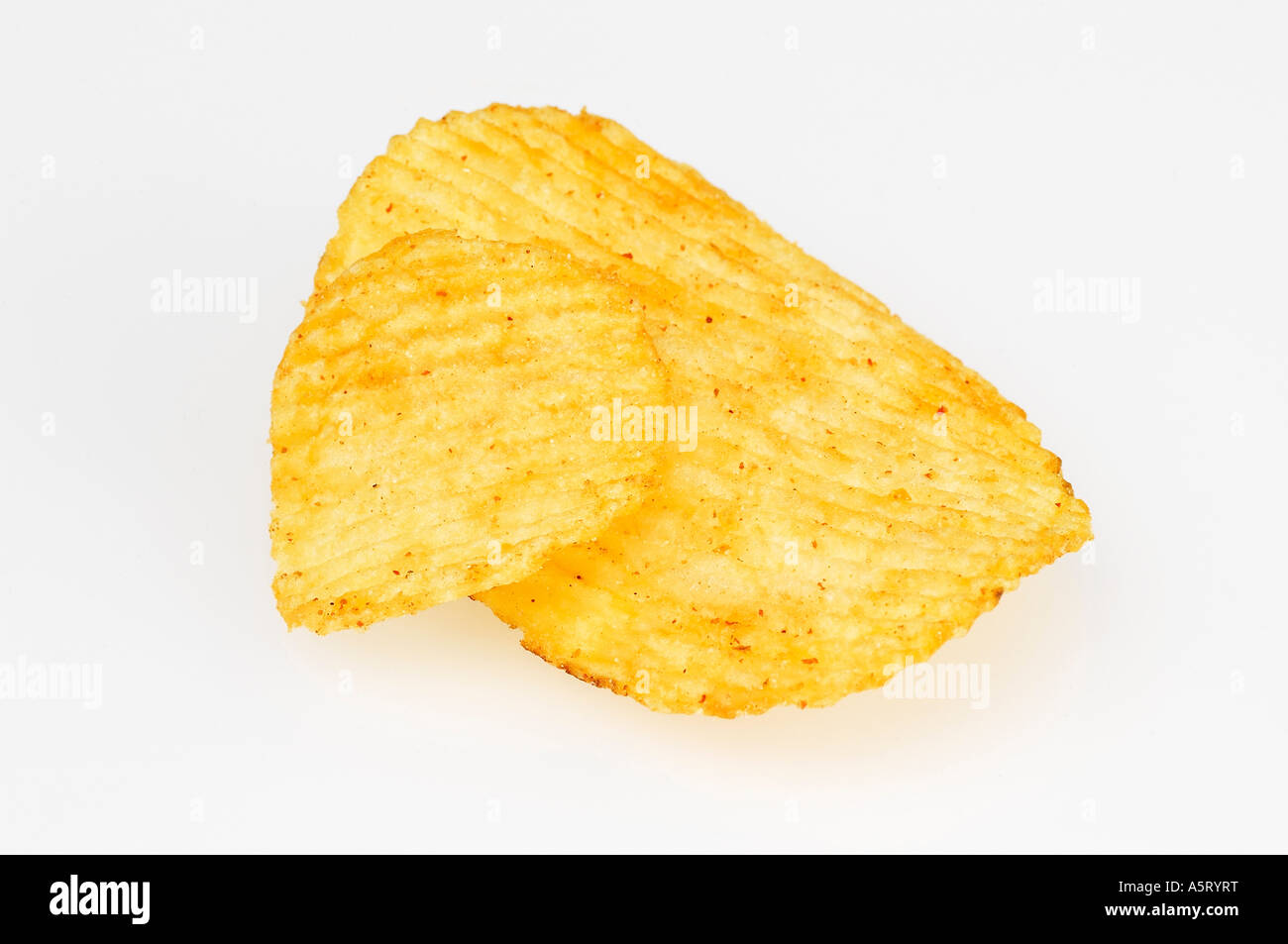 Flakes of crisps on white background Stock Photo - Alamy