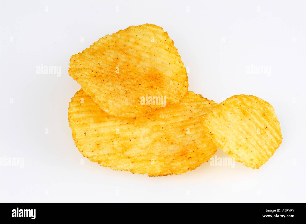 Flakes of crisps on white background Stock Photo - Alamy