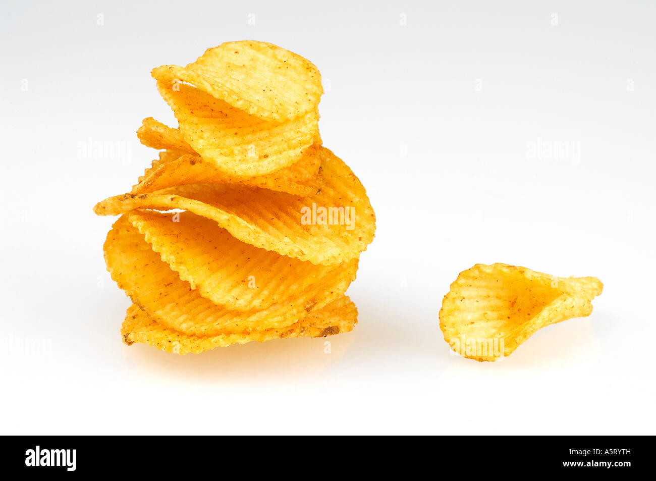 Stack of crisps on white background Stock Photo - Alamy