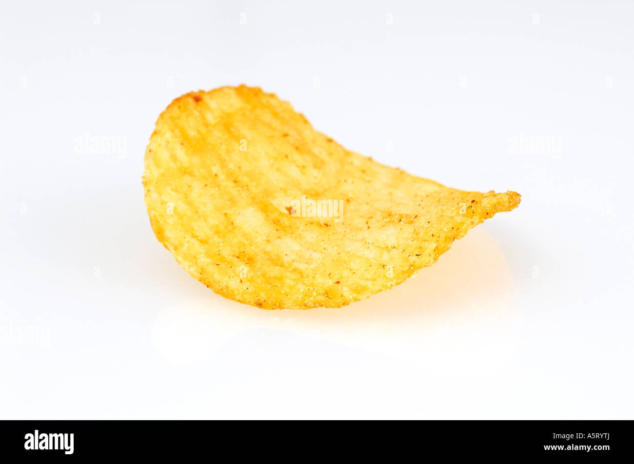 Flake of crisps on white background Stock Photo - Alamy