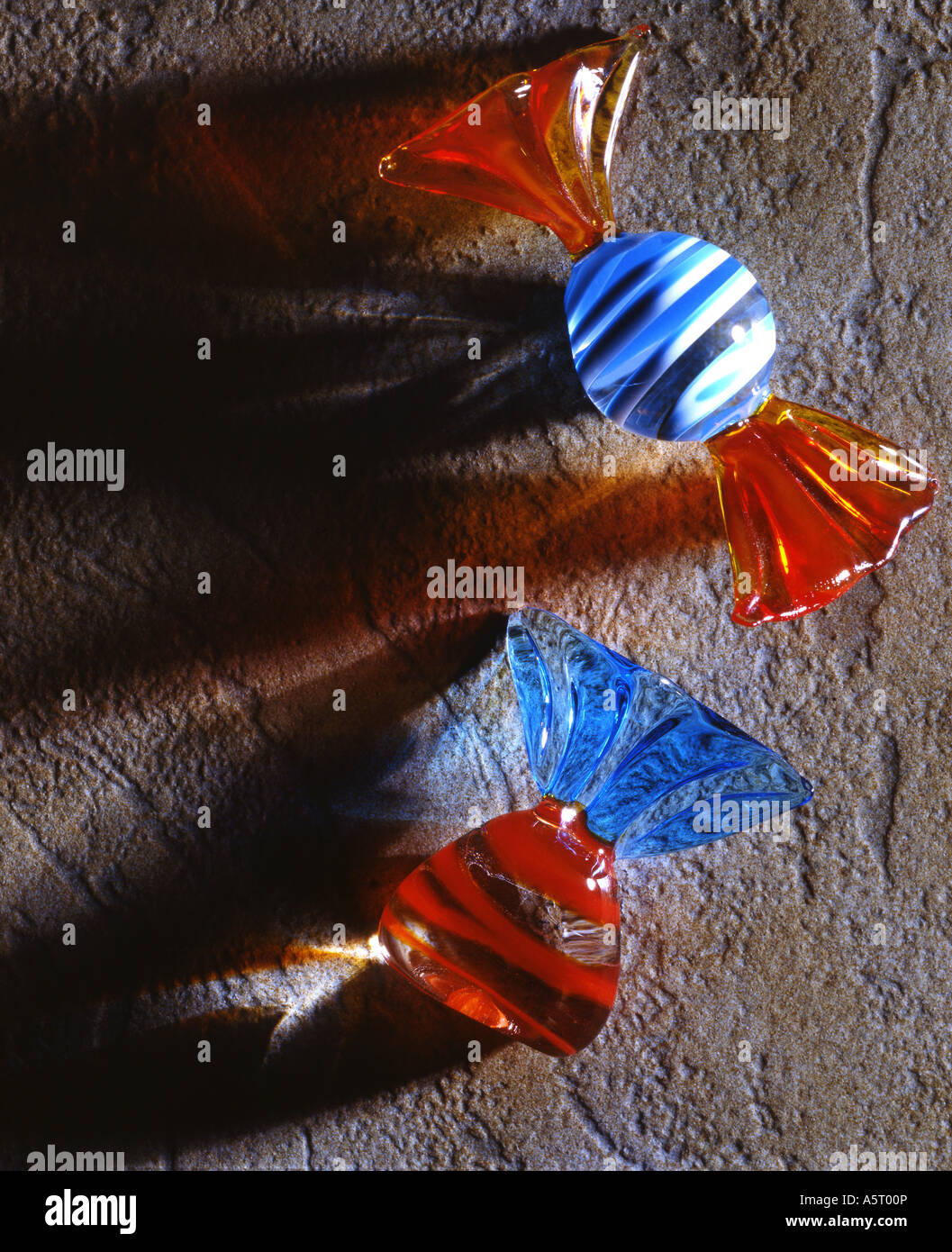 Glass candies on stone Stock Photo - Alamy