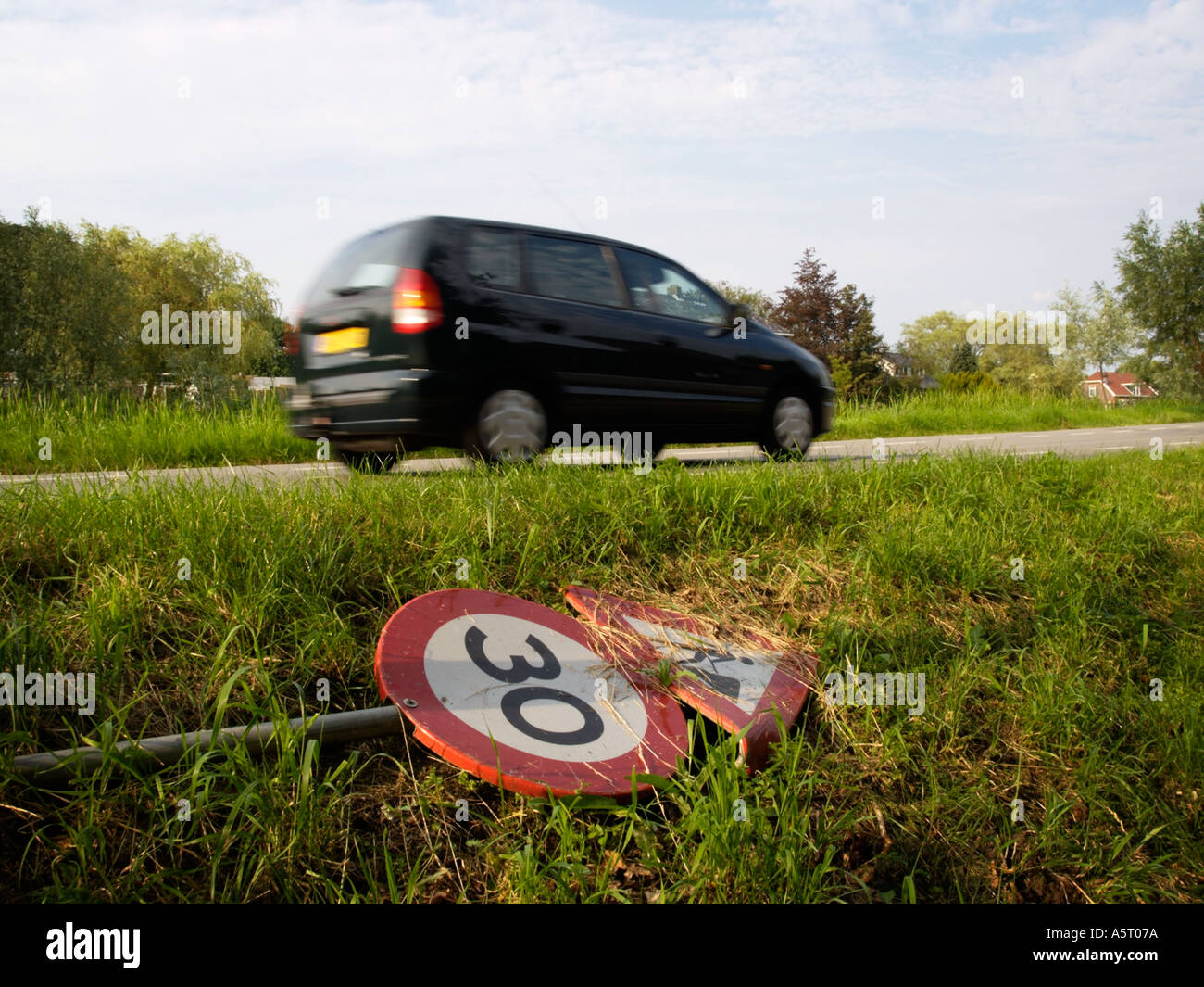 Driving fast past speed limit sign hi-res stock photography and images ...