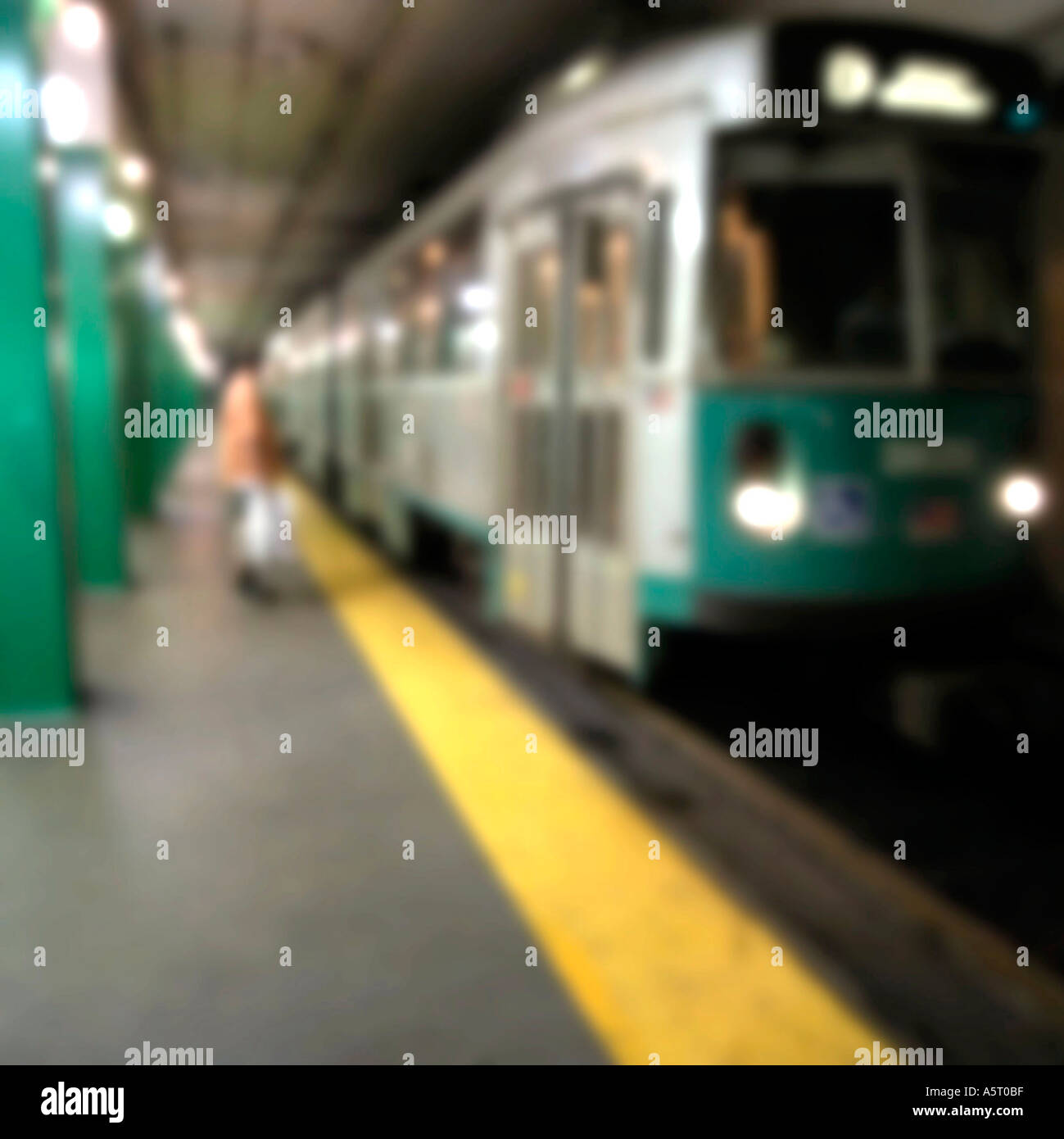 Person standing on platform of Train Station Stock Photo - Alamy