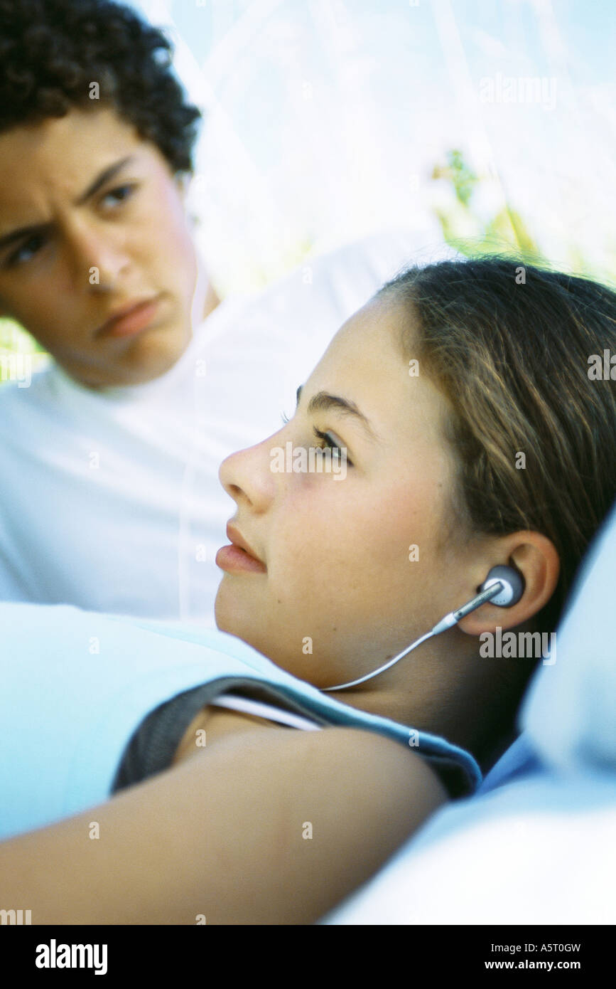 Teens sharing earbuds hi-res stock photography and images - Alamy