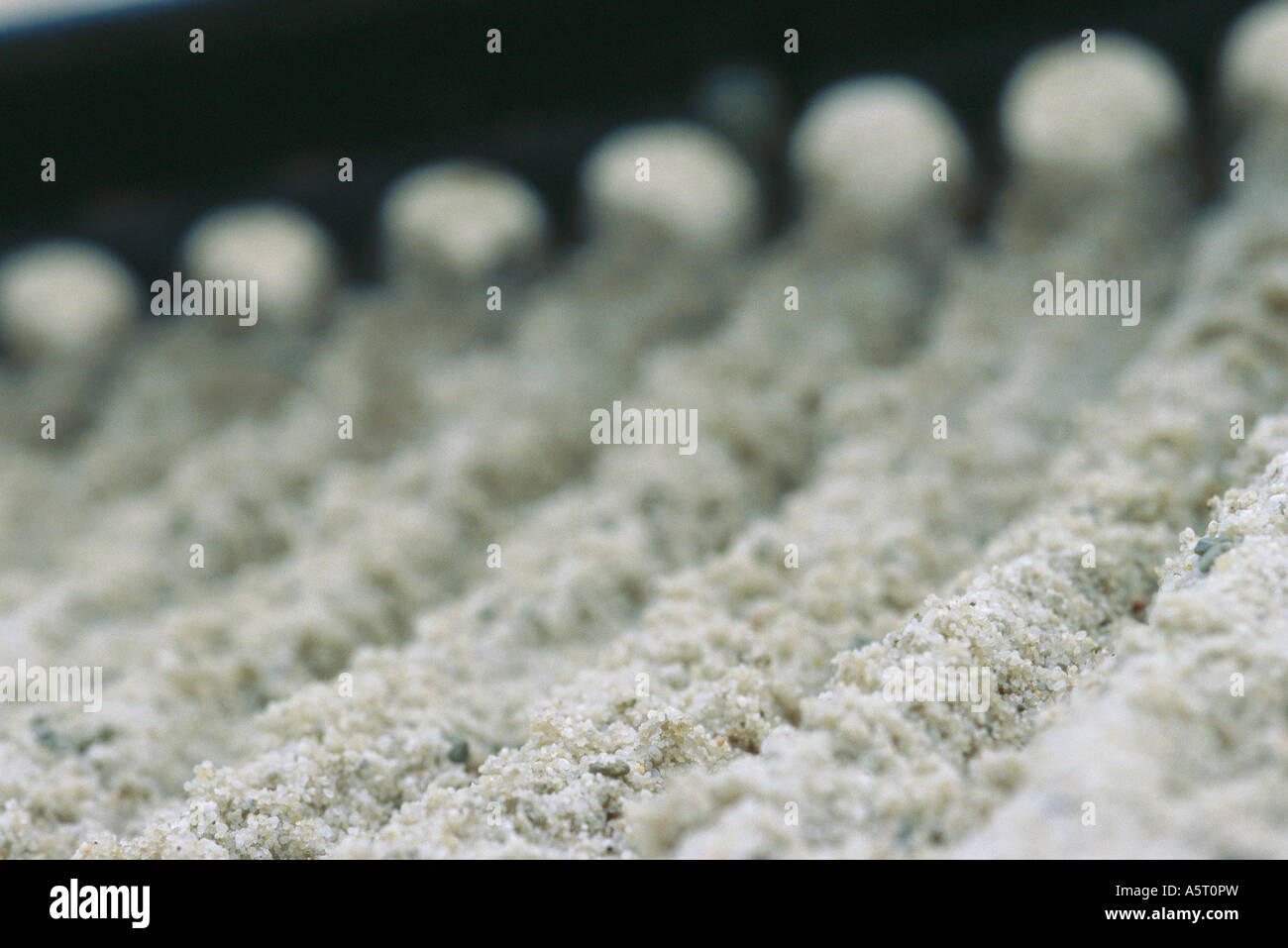 Raking sand trap, extreme close-up Stock Photo - Alamy