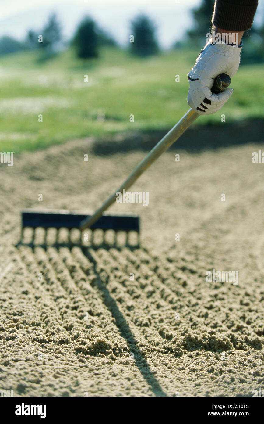 Rake in sand bunker on hi-res stock photography and images - Alamy