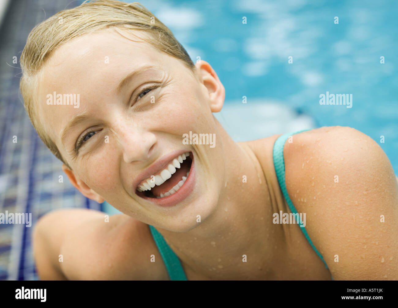 Woman emerging from pool hi-res stock photography and images - Alamy