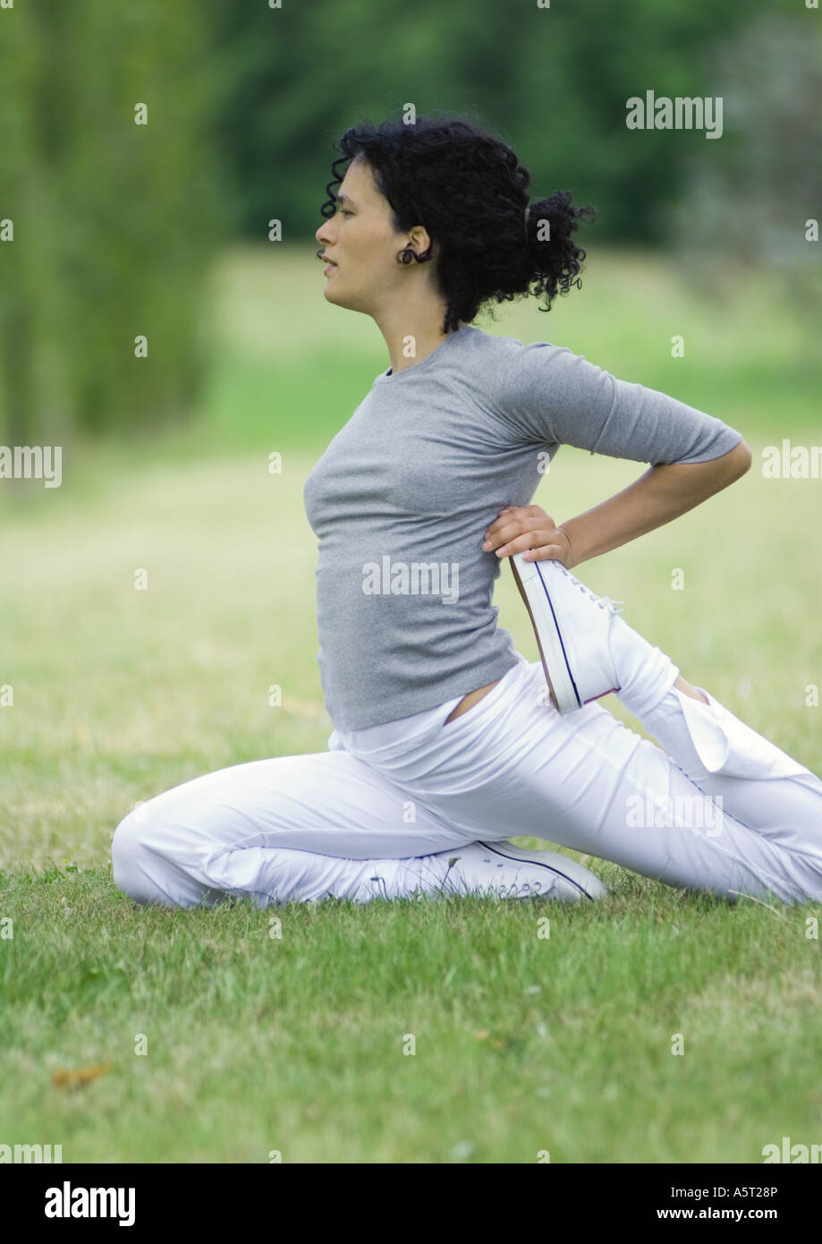 Exercising exercise at work stretching on the ground sports hi-res ...