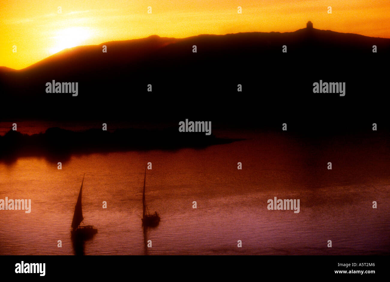 Feluccas on the River Nile at Dusk Aswan Egypt Stock Photo - Alamy