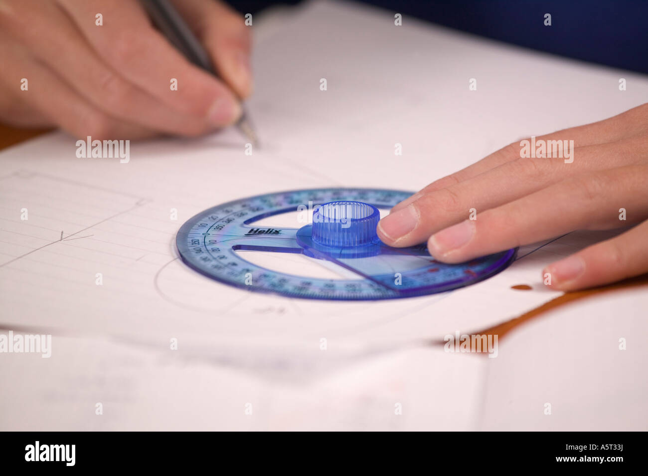 Teenage boy holding a protractor hi-res stock photography and images ...