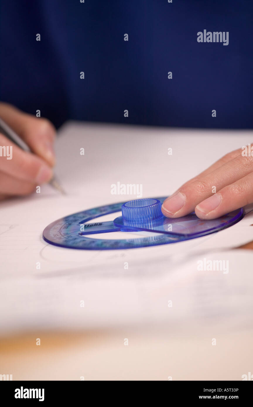 Teenage boy holding a protractor hi-res stock photography and images ...