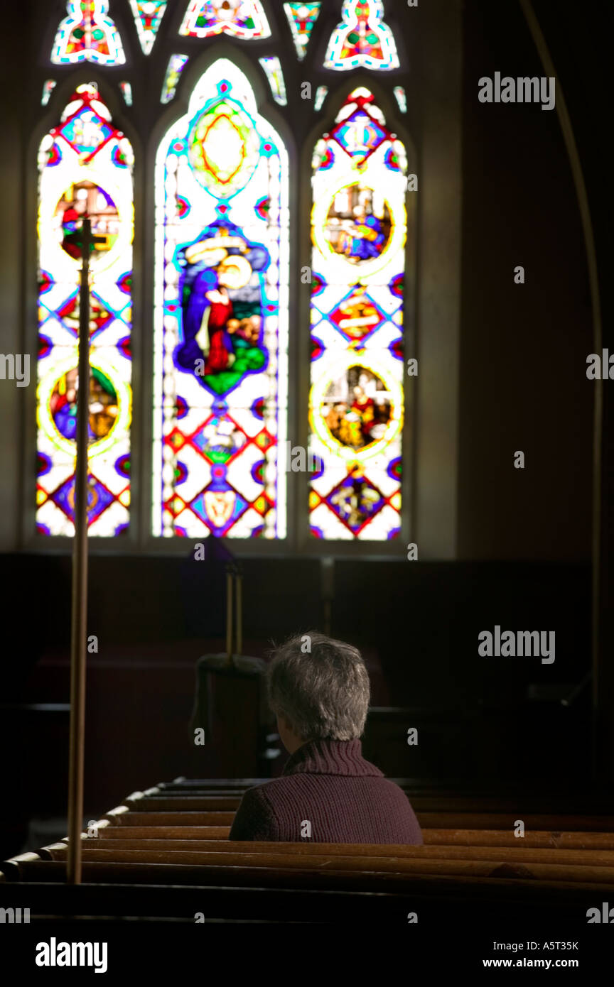 Praying stained glass window window hi-res stock photography and images ...