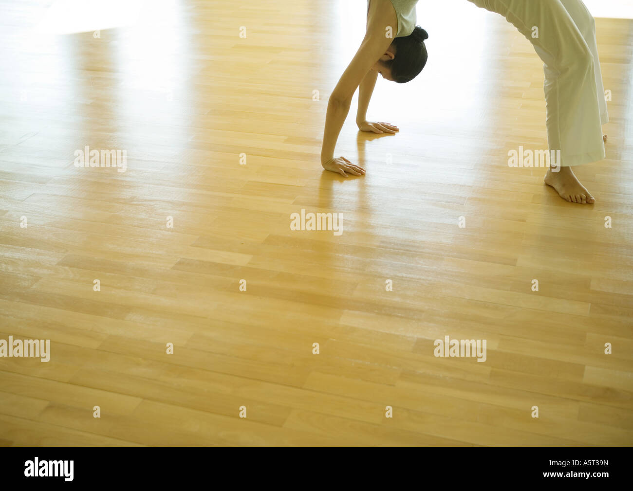 Yoga class, woman doing backbend Stock Photo - Alamy