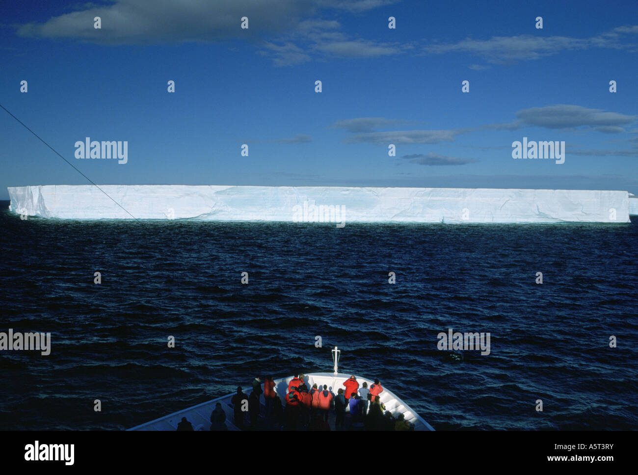 Cruise ship bearing down on tabular iceberg Weddell Sea Antarctica ...