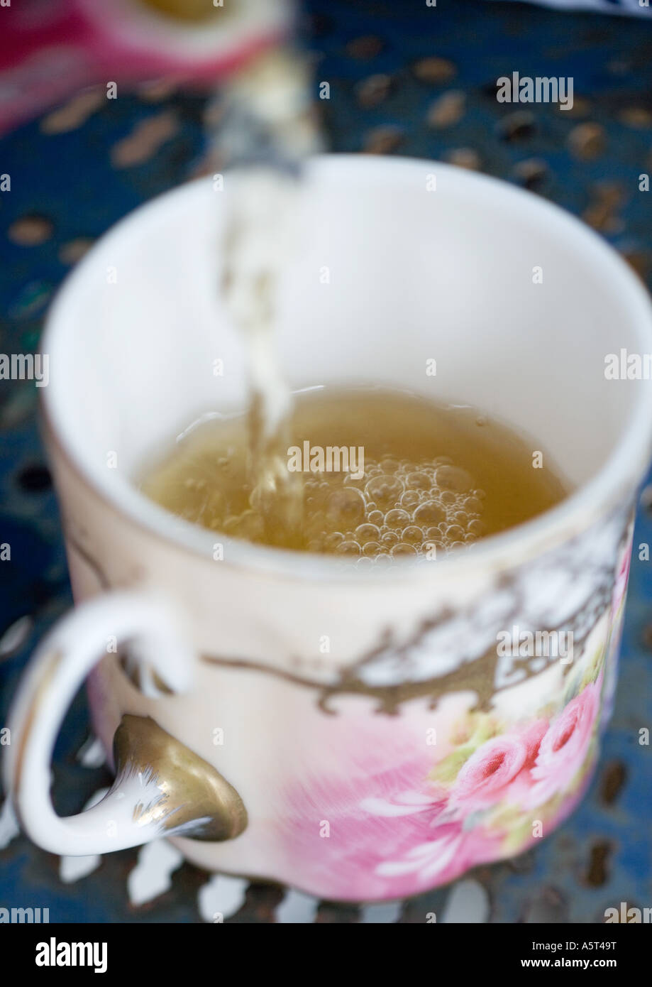 Tea being poured into tea cup hi-res stock photography and images - Alamy