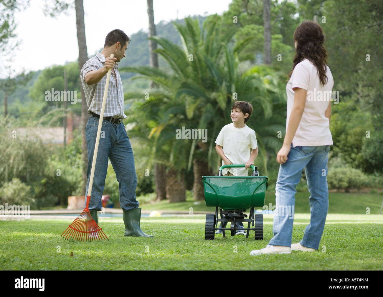 Family doing yardwork Stock Photo - Alamy