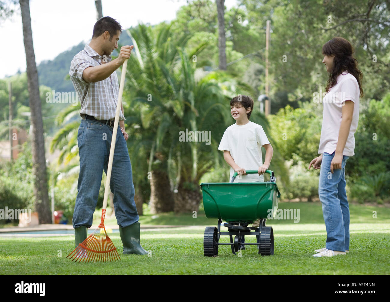 Family doing yardwork Stock Photo - Alamy