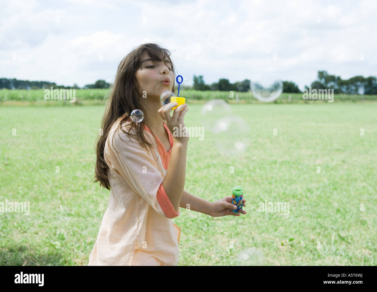 Children blowing bubbles bubble wands hi-res stock photography and ...