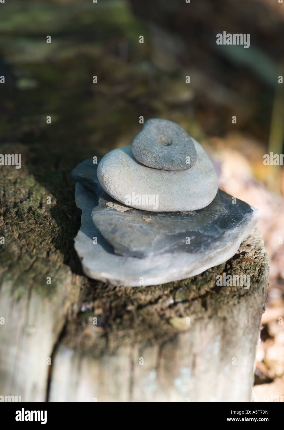 Stack of stones on stump Stock Photo - Alamy