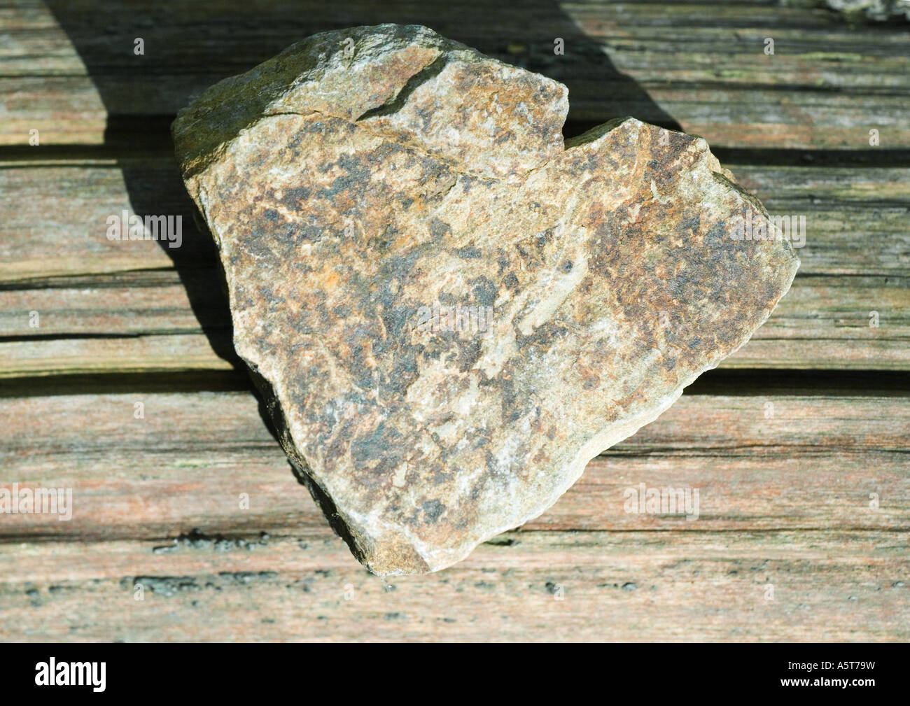 Stone on wood Stock Photo - Alamy