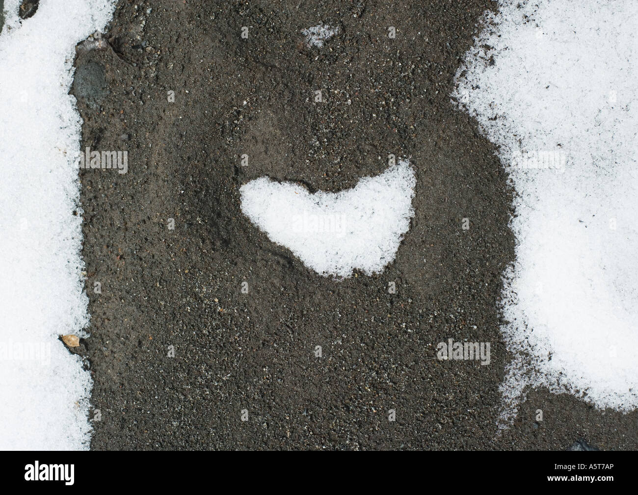 Heart-shape made of snow Stock Photo - Alamy