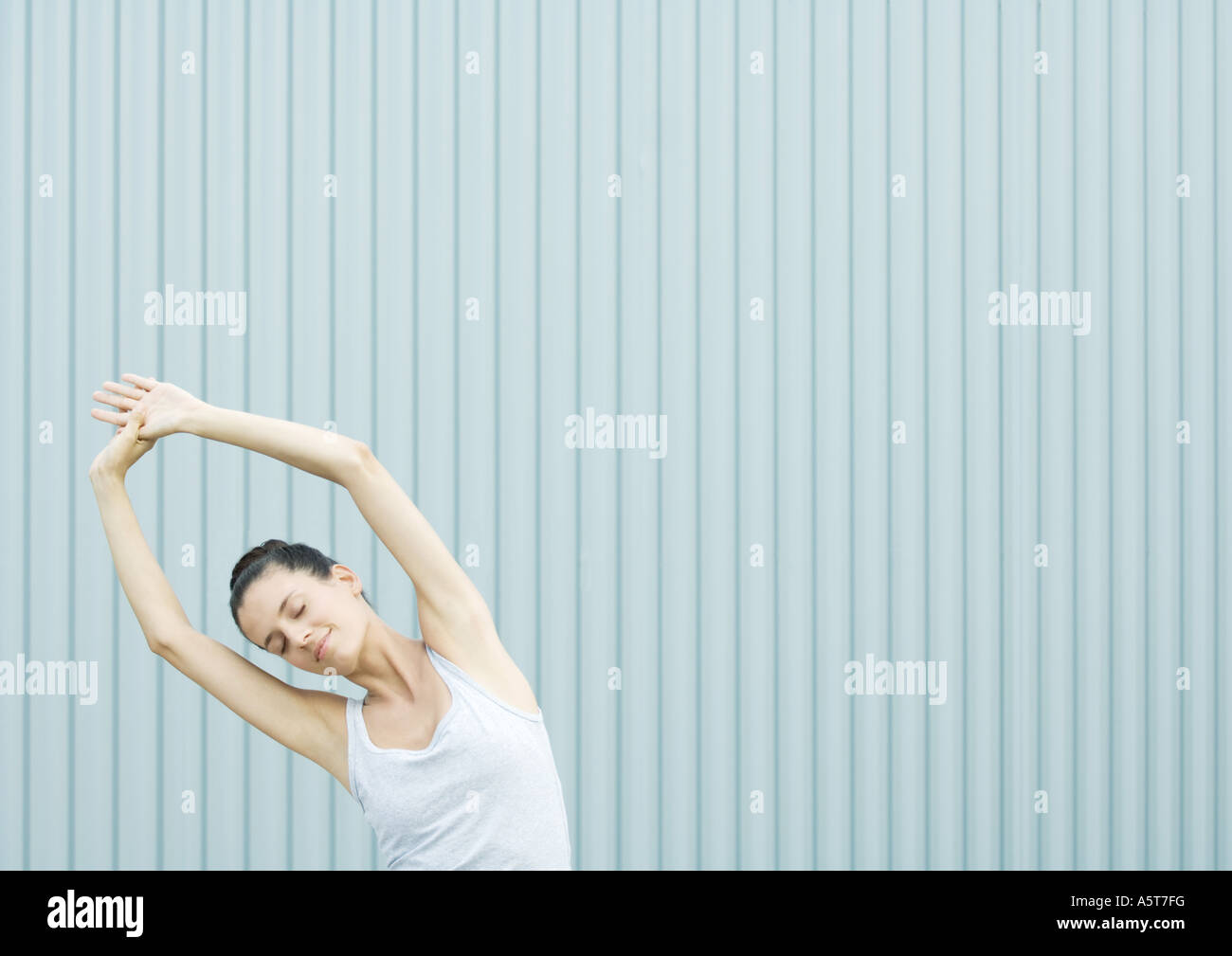 Woman doing side stretch Stock Photo - Alamy