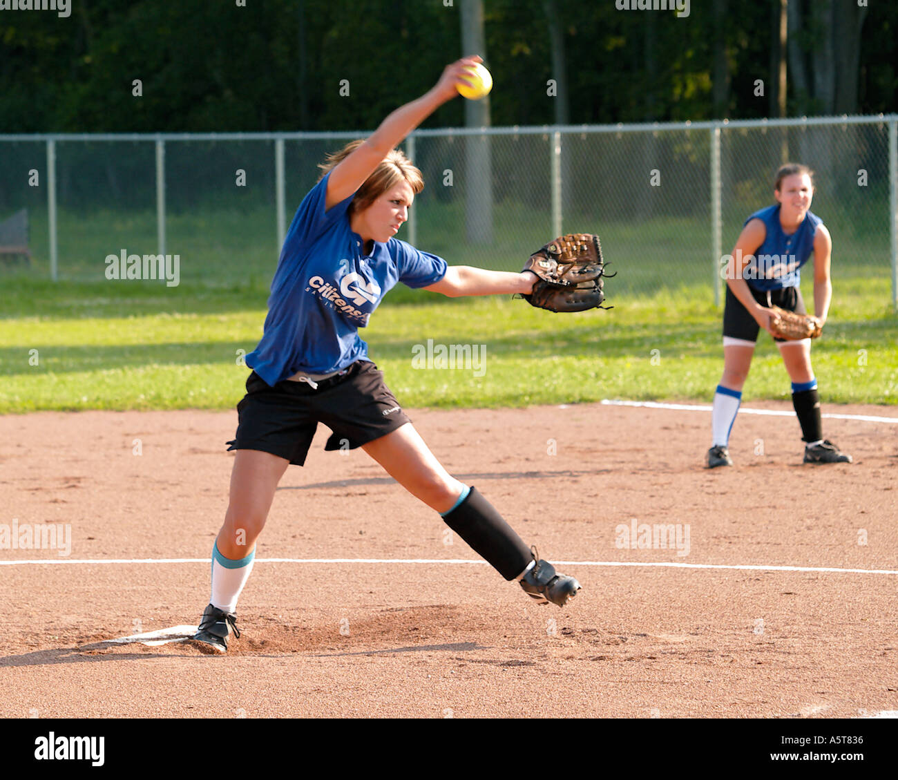 Youth girls softball pitcher in action Stock Photo - Alamy