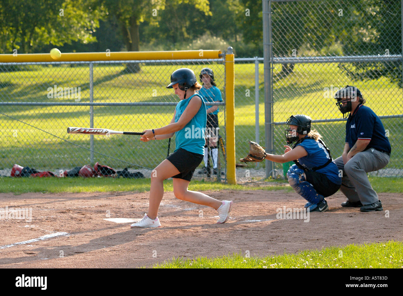 Youth girls softball player connects for a hit Stock Photo - Alamy