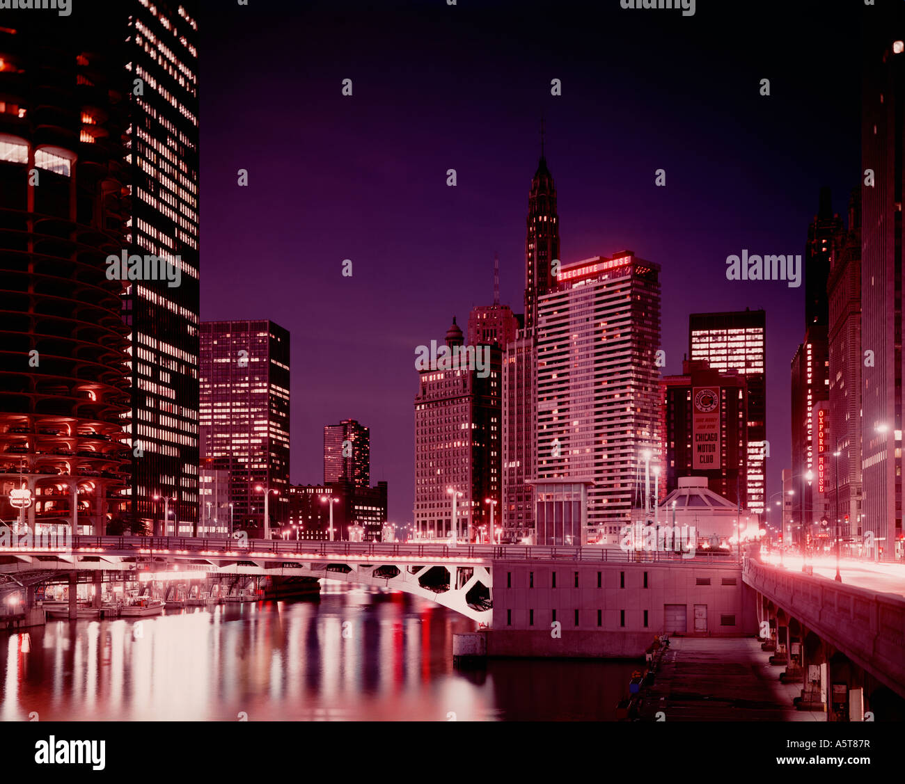 Downtown Chicago at night with dark sky and illuminated skyscrapers ...