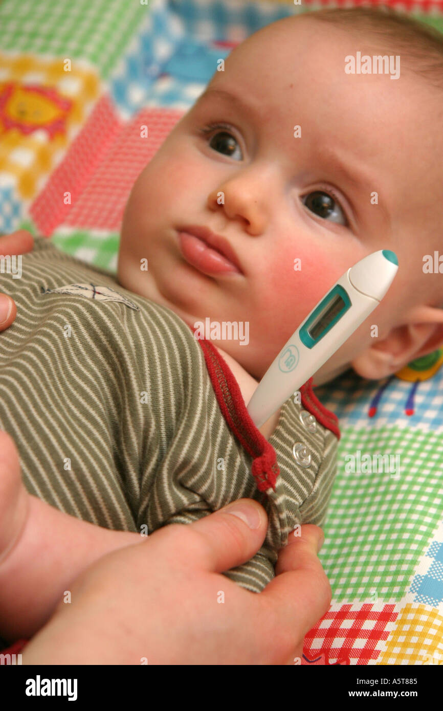 boy having temperature taken Stock Photo - Alamy