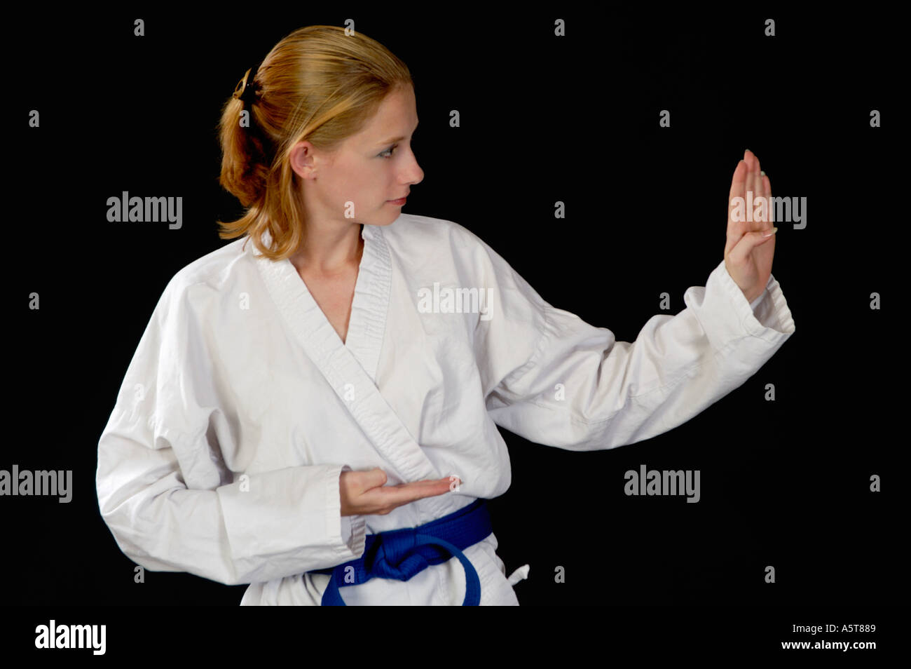 Woman doing karate moves Stock Photo - Alamy