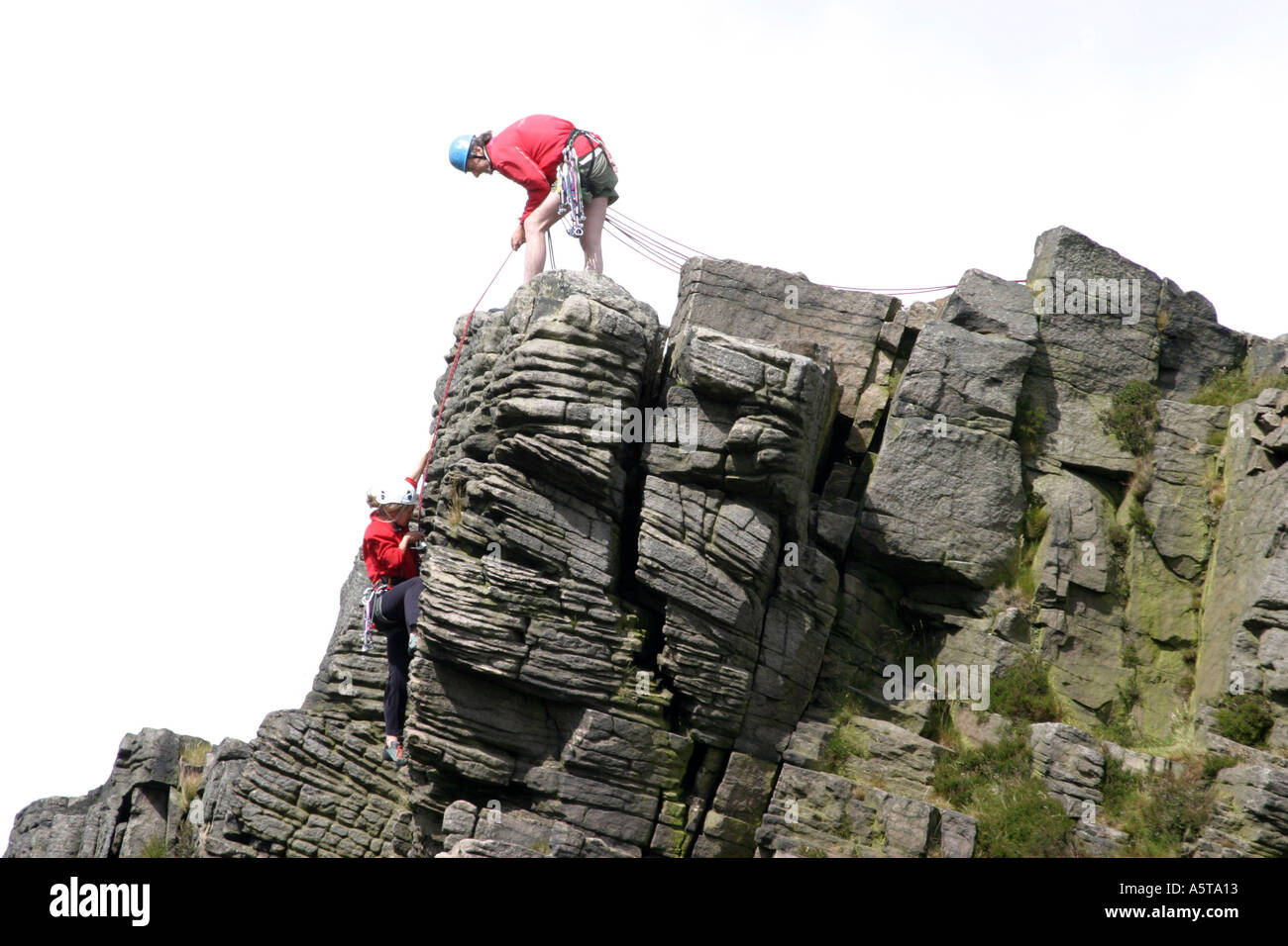 Climbers on Windgather rocks on the Eastern side of the Peak District ...