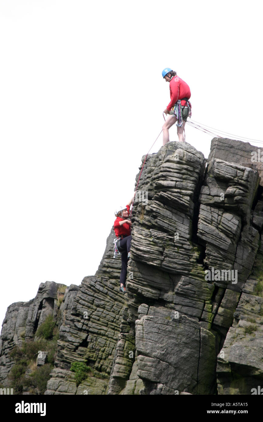 Climbers on Windgather rocks on the Eastern side of the Peak District ...