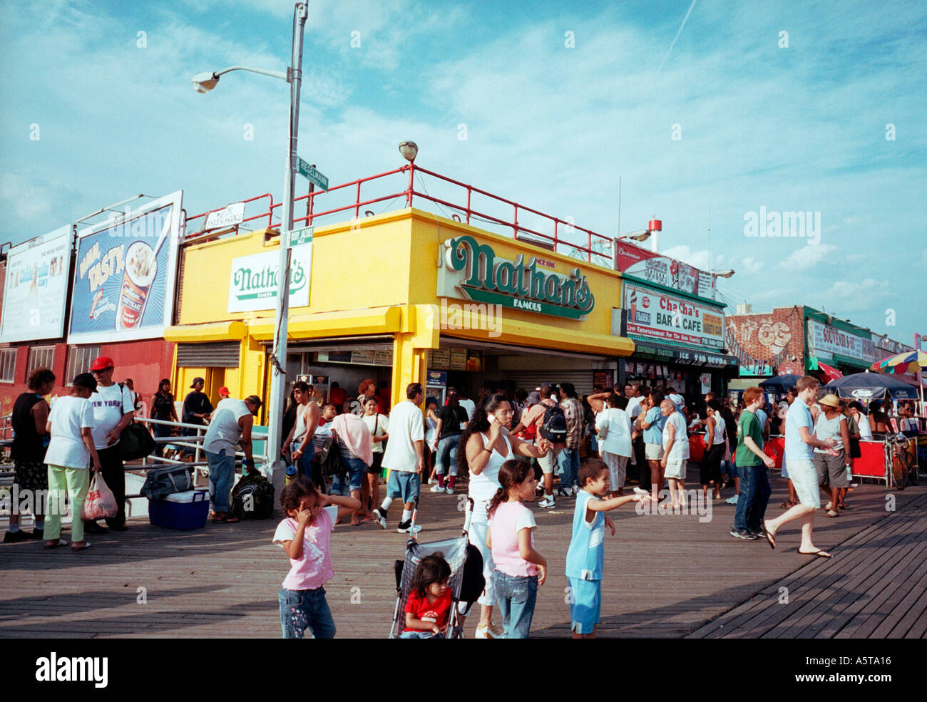 Visitors to Coney Island at the Nathan s boardwalk fast food restaurant ...