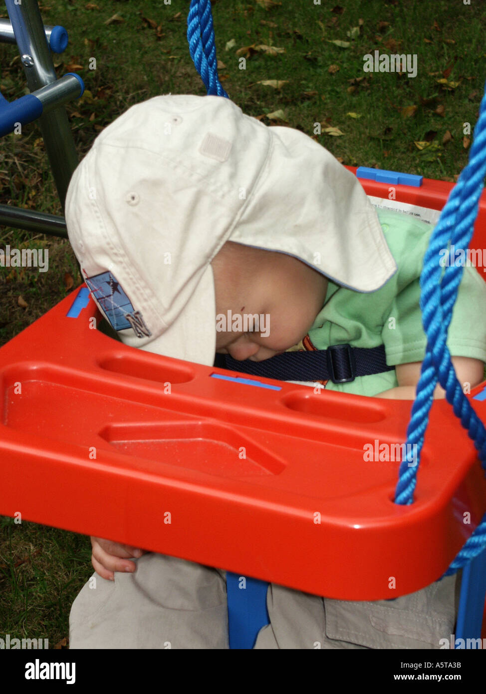 Child dozing garden swing hi-res stock photography and images - Alamy